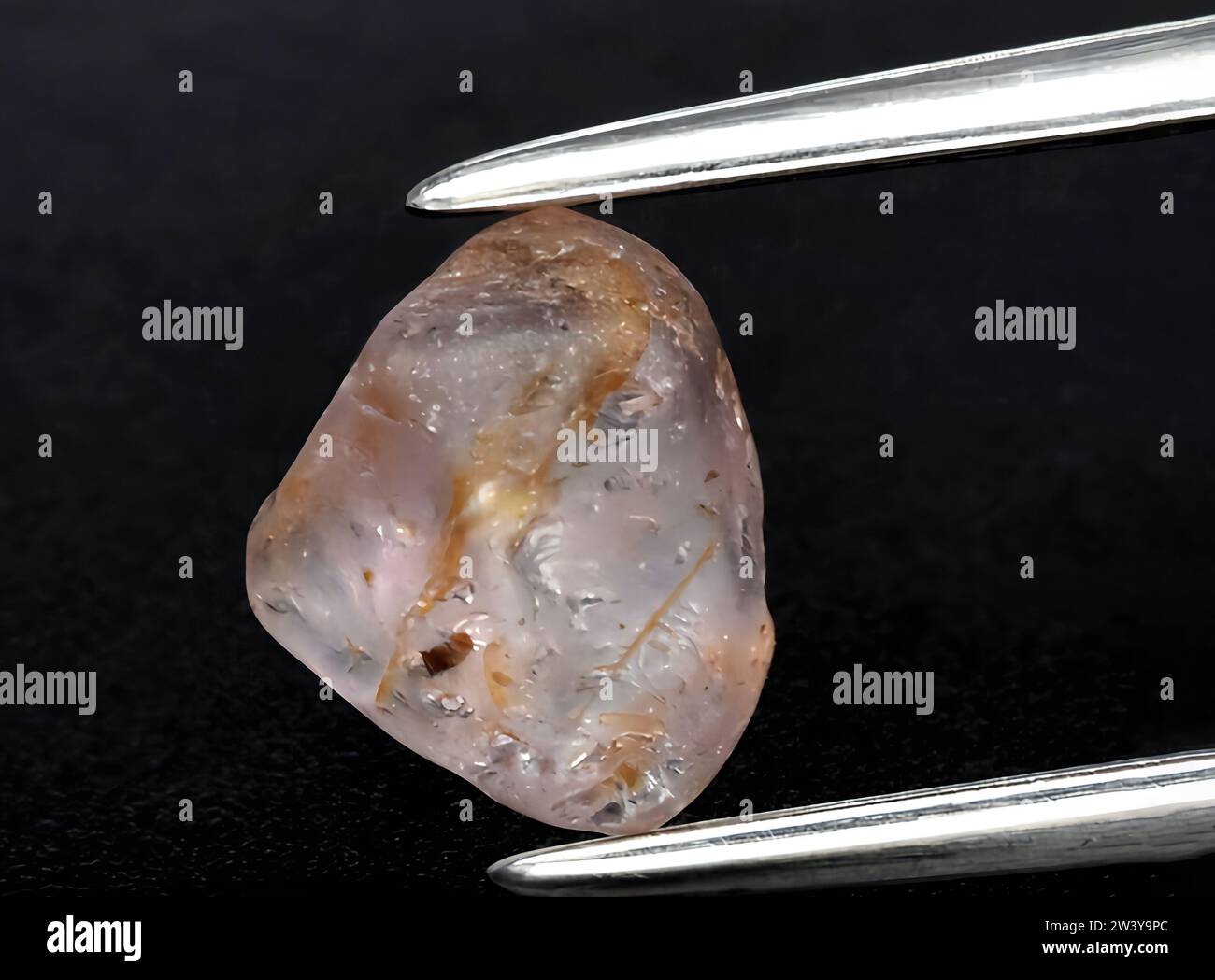 natural light pink sapphire gem on background Stock Photo - Alamy