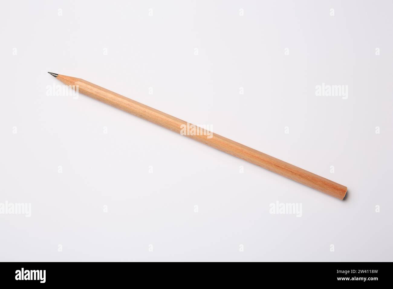 Sharp graphite pencil on white background, top view Stock Photo - Alamy