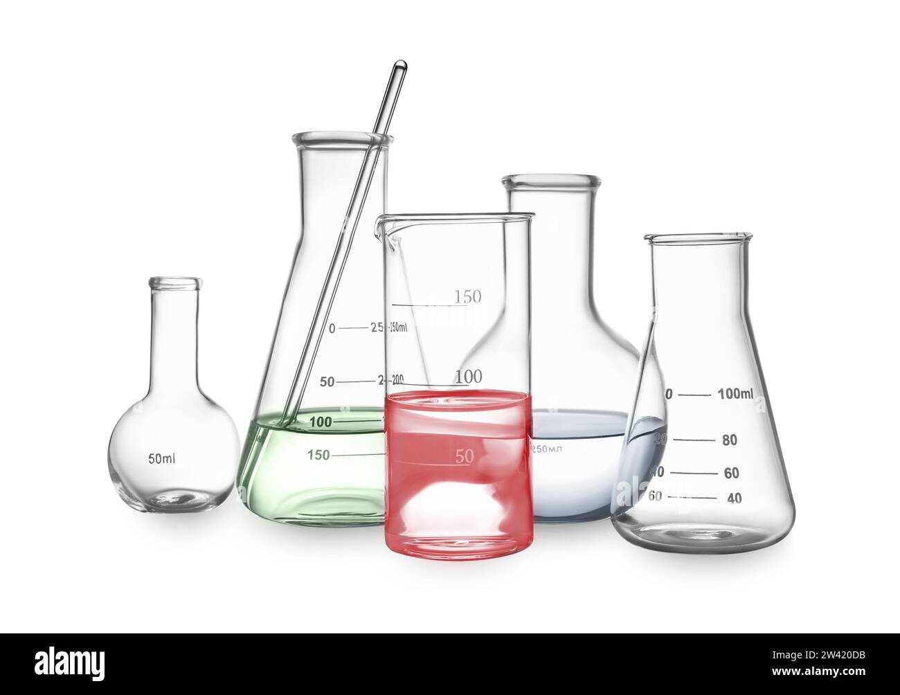Different laboratory glassware with colorful liquids and stirring rod ...