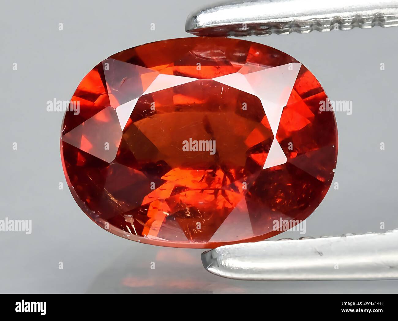 natural orrange spessartien garnet gem on background Stock Photo - Alamy