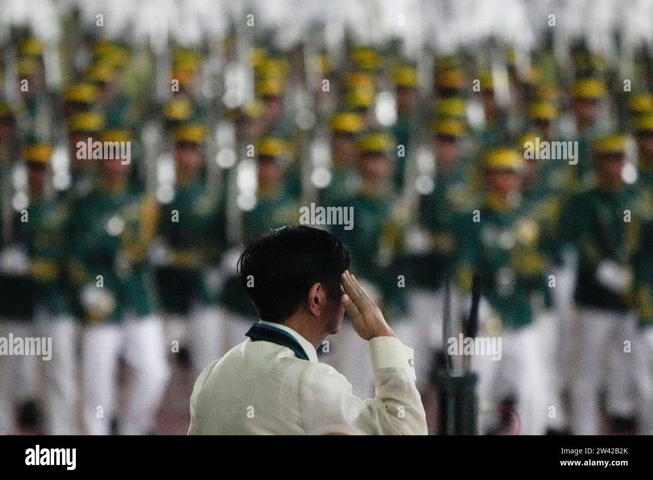 Philippines' President Ferdinand Marcos Jr. salutes as troops pass ...
