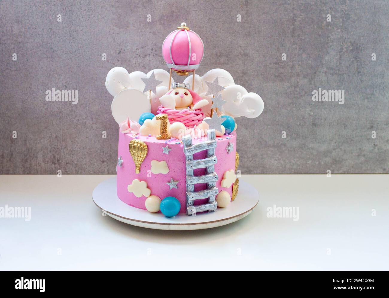 Beautiful pink cake for girl's birthday with fondant bunny, ladder ...
