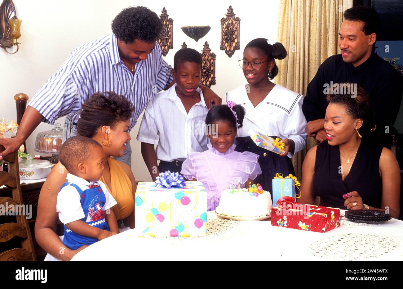 Large three generation family celebrating birthday party at home ...
