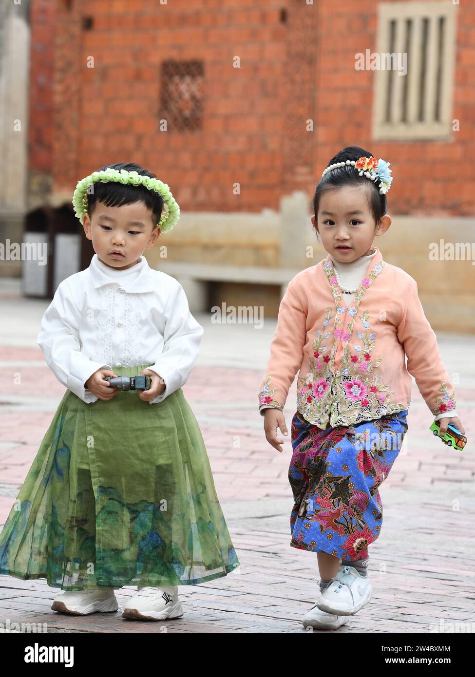 JINJIANG, Dec. 21, 2023 (Xinhua) -- Children have fun in Wulin Village ...