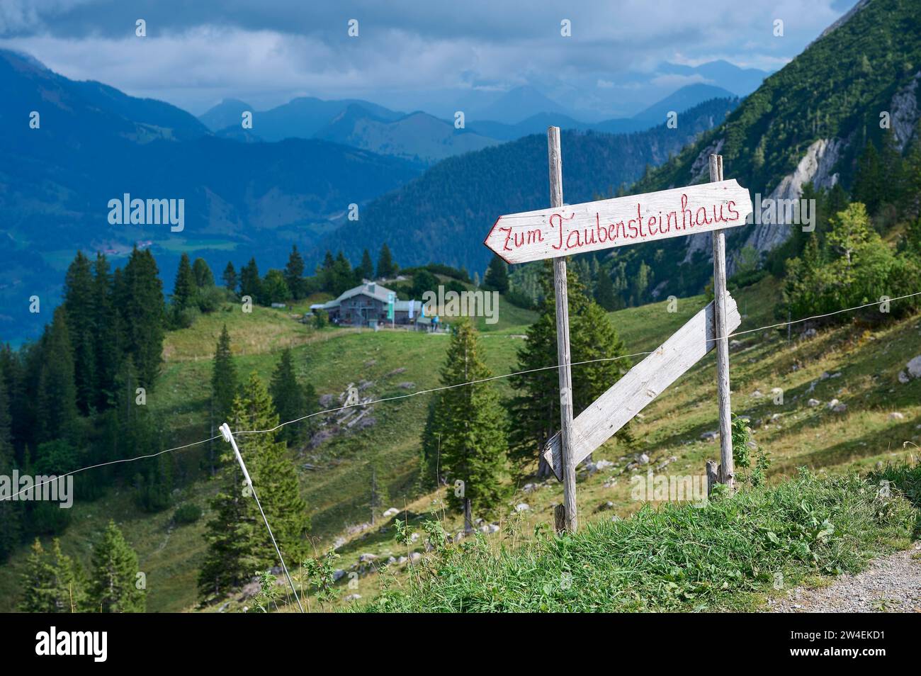 Signpost to the Taubensteinhaus, mountain hut of the Munich section of ...