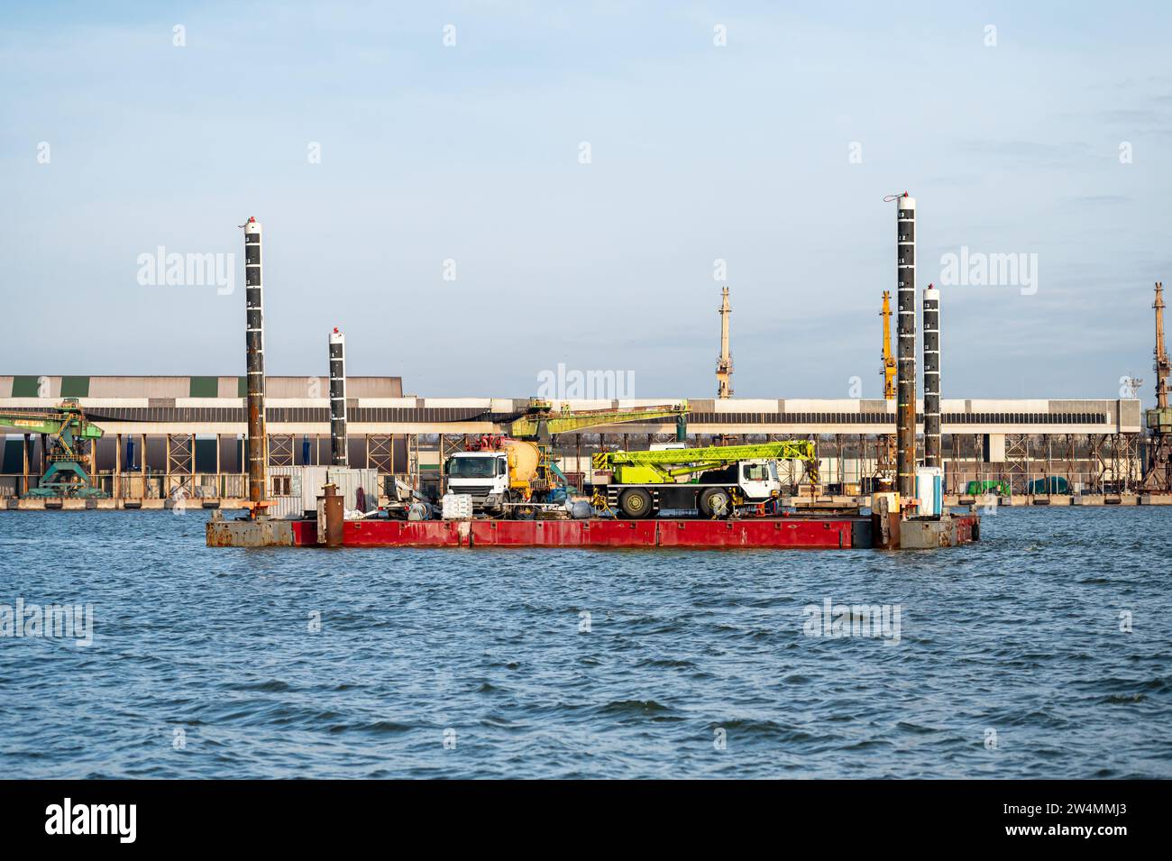 Floating platform with crane for hydrotechnical works and concrete ...