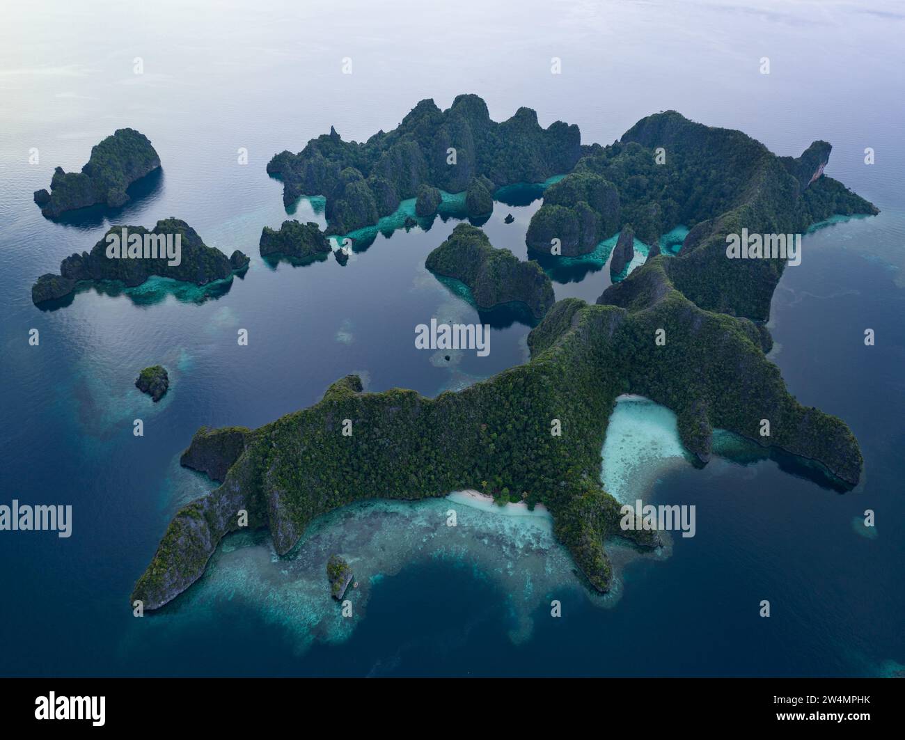 Limestone islands rise from the seascape in Raja Ampat, Indonesia ...