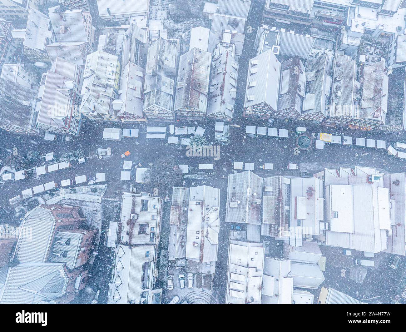 Bird's eye view of snow pattern and Christmas market formed by urban ...