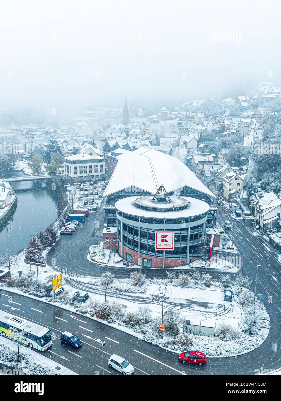 Aerial view of Kaufland, snow-covered shopping centre on a city street ...