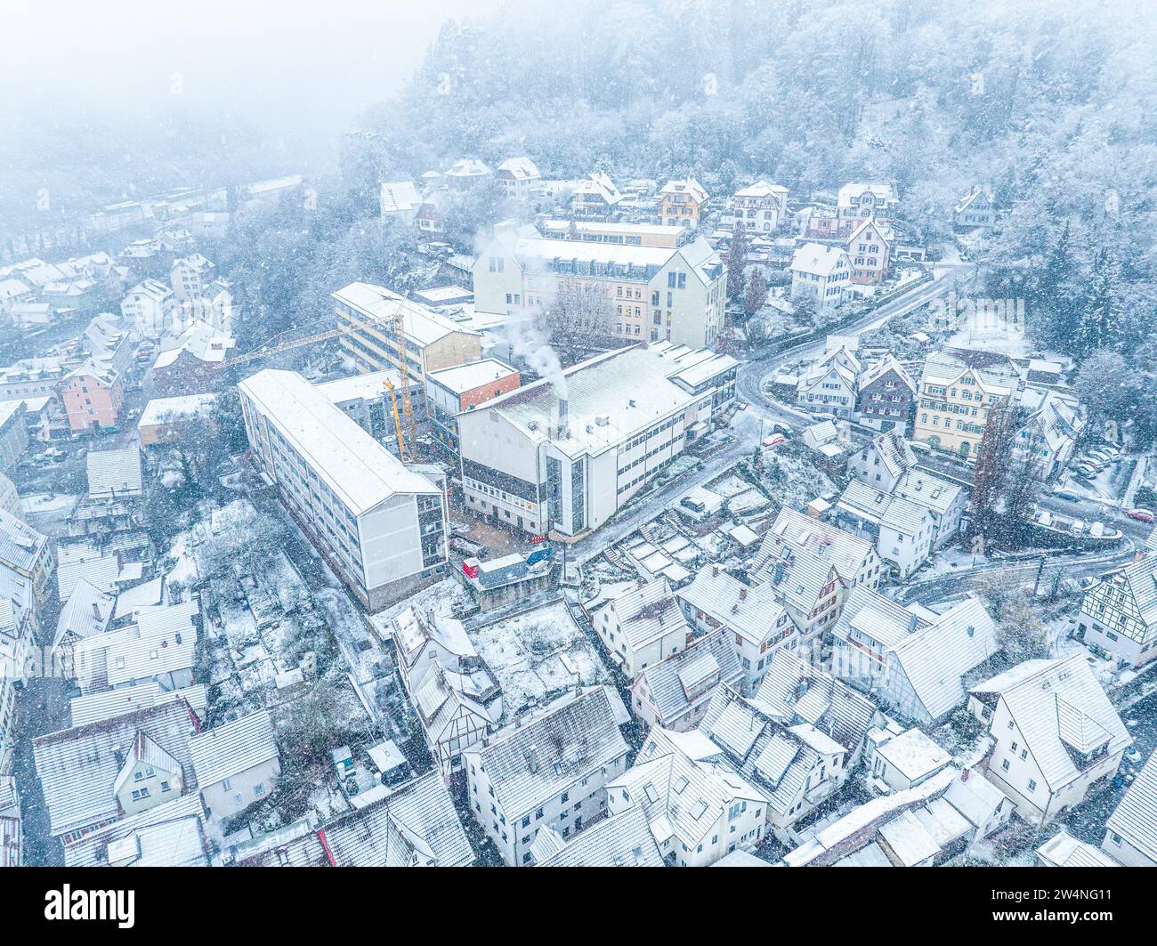 Aerial view of a town covered in snow with a mix of modern and older ...