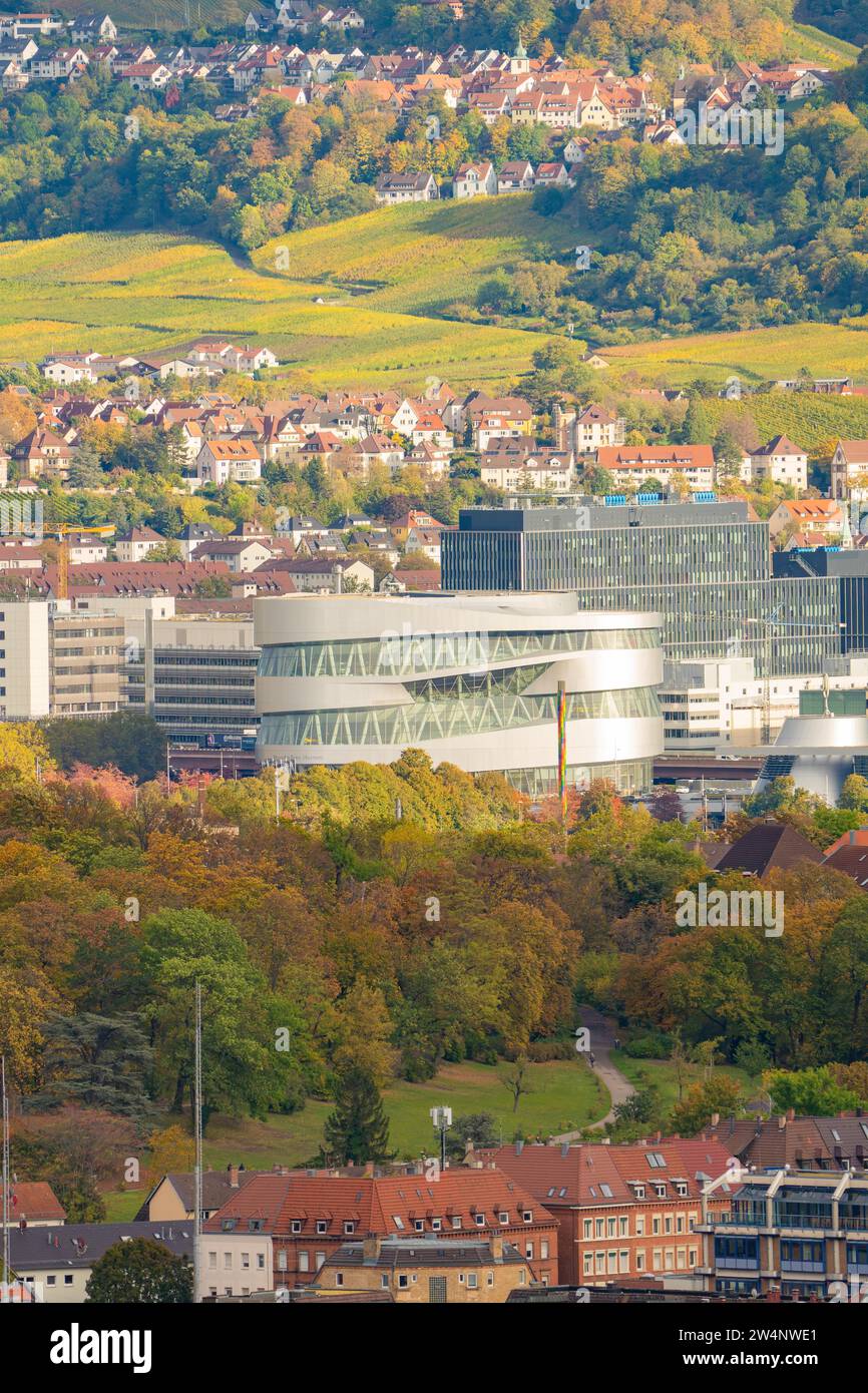 Urban park with modern buildings and a pedestrian bridge in the ...