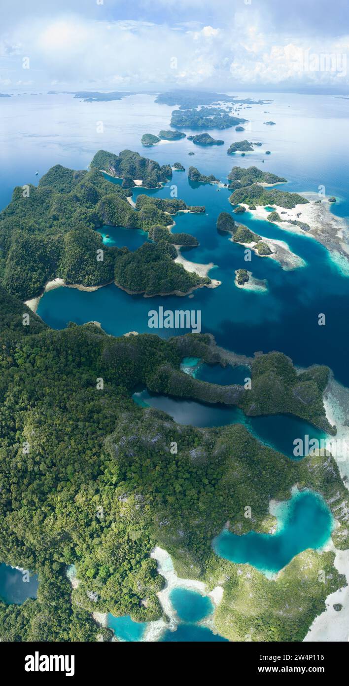 Limestone islands rise from the seascape in Raja Ampat, Indonesia ...
