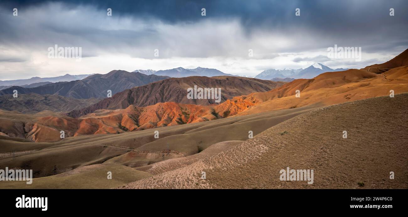 View over eroded mountainous landscape of Konorchek Canyon with red ...