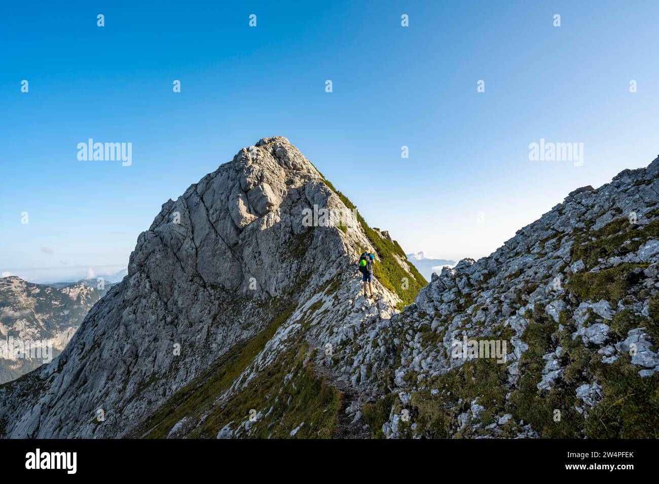 Mountaineer on a narrow ridge, mountain tour to the summit of the ...