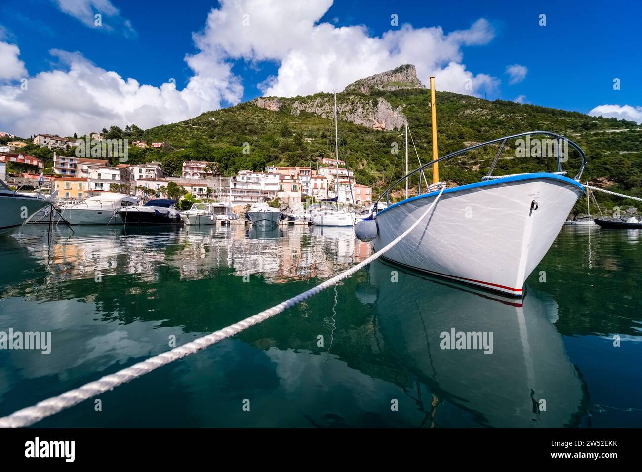 Harbour and houses of Porto di Maratea, overlooked by the Statue of ...