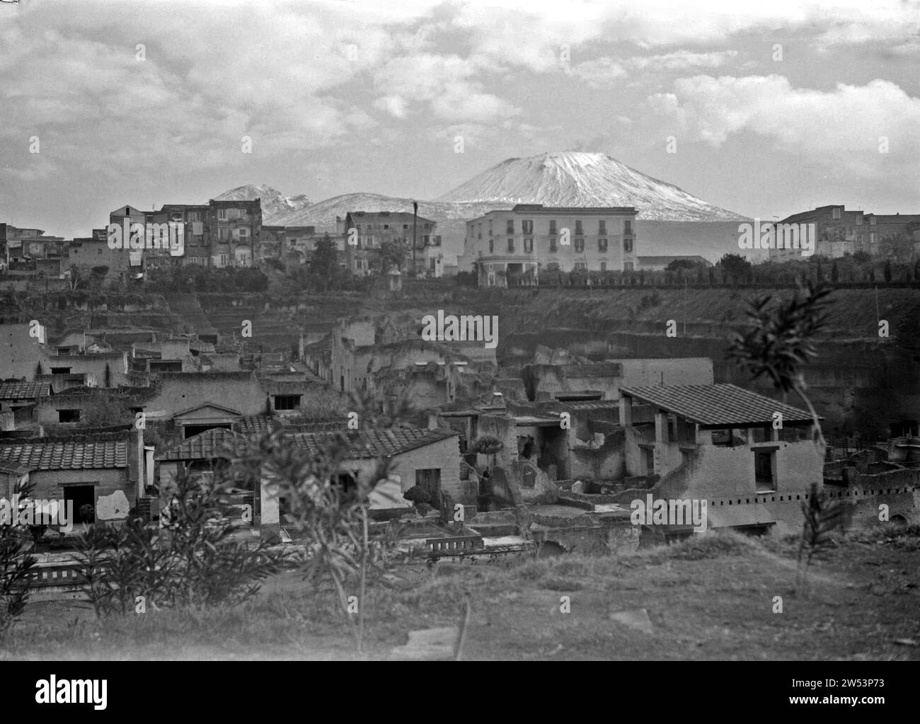 Image of the ruins of the city of Herculaneum with Mount Vesuvius in ...