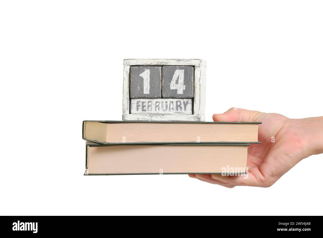 Calendar with date February 14th and books in hand on a white ...