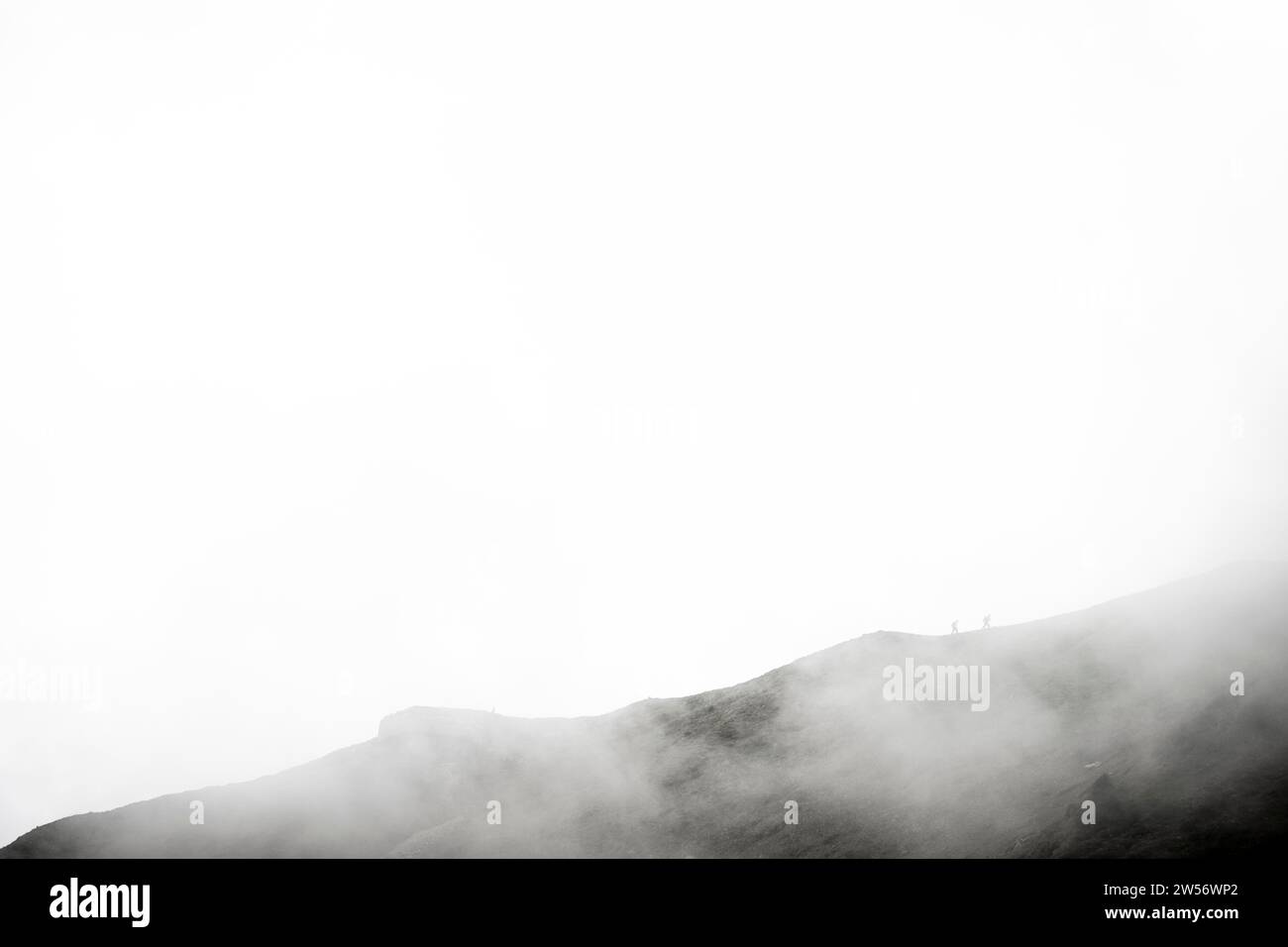 Mountaineer on a mountain ridge in the fog, Interlaken, Bernese ...