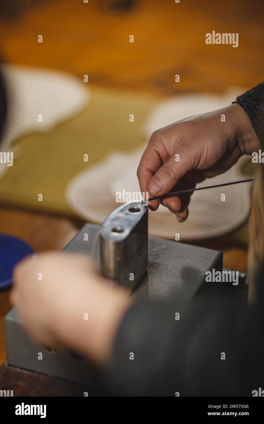 Unrecognizable luthier lute maker artisan hands in his workshop ...