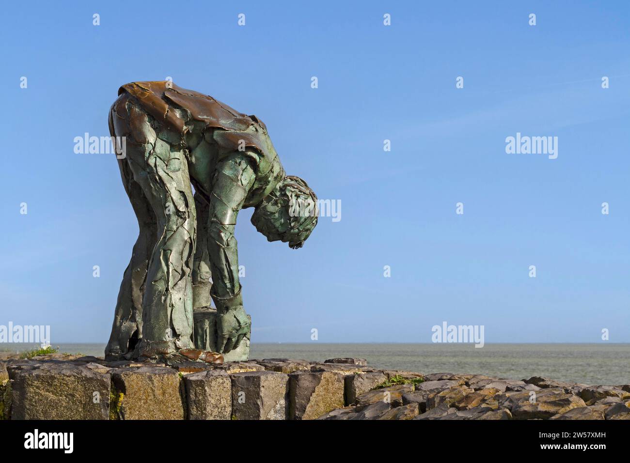 Monument to the stone setter on the Afsluitdijk between the Wadden Sea ...