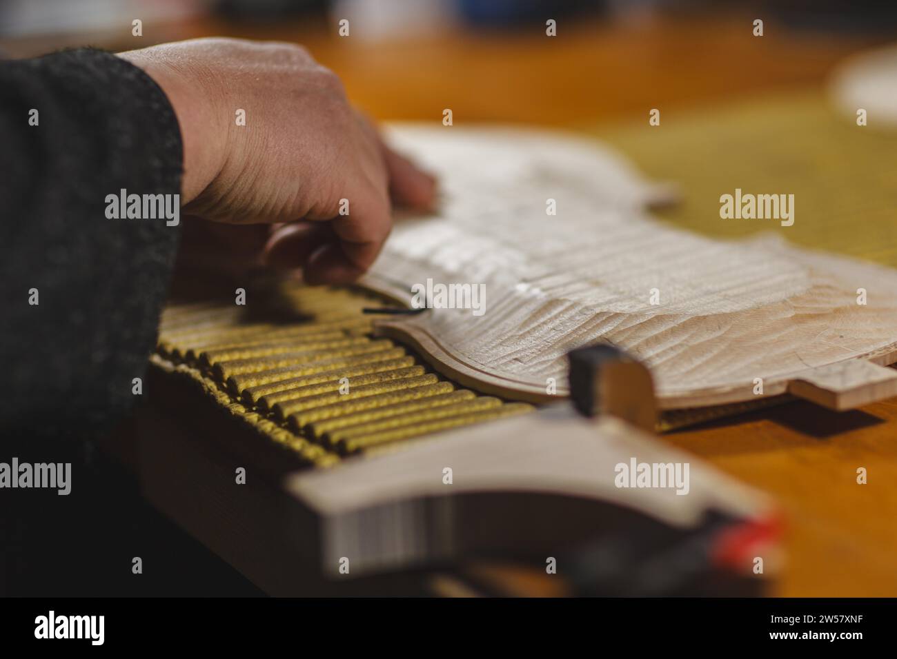 Unrecognizable luthier lute maker artisan hands in his workshop push ...