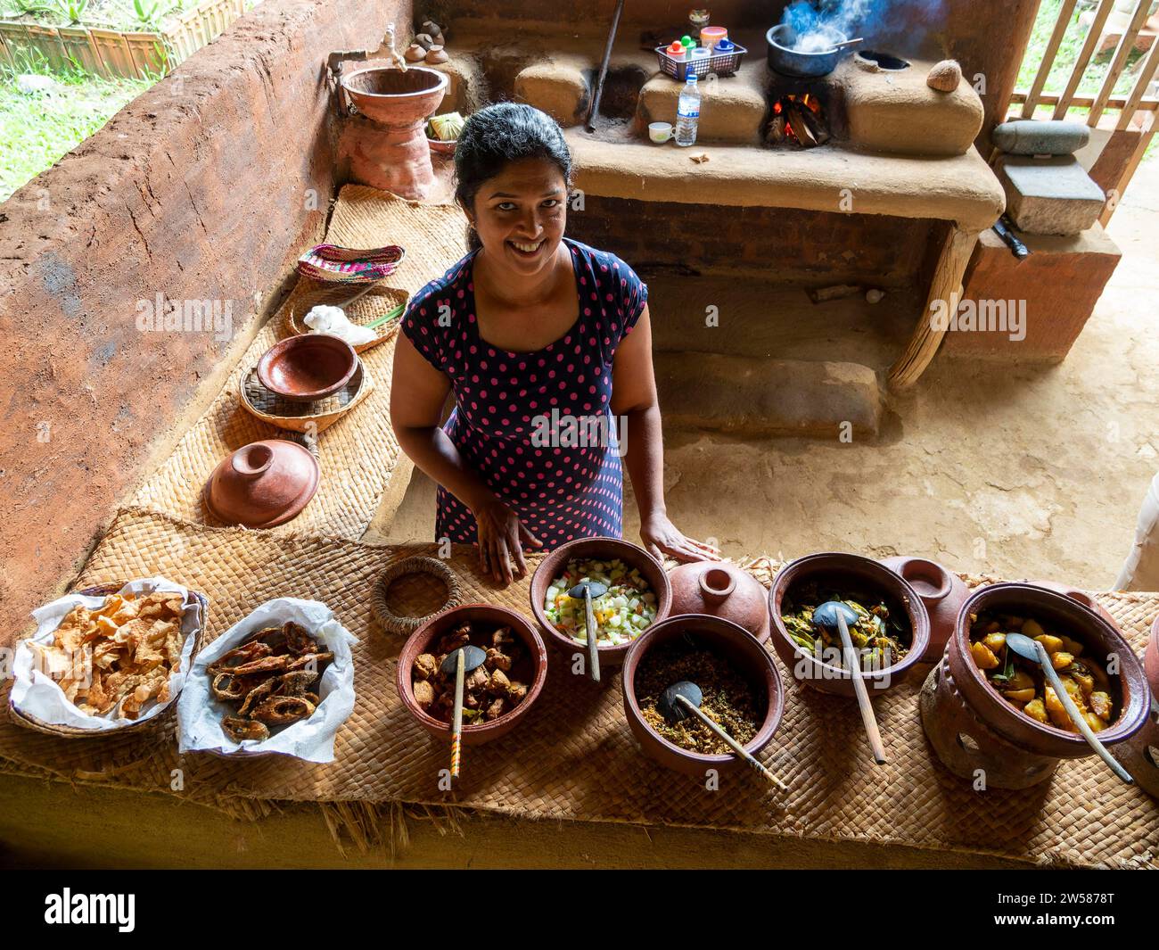 Sinhala woman prepares lunch in clay pots, Sri Lanka Stock Photo - Alamy
