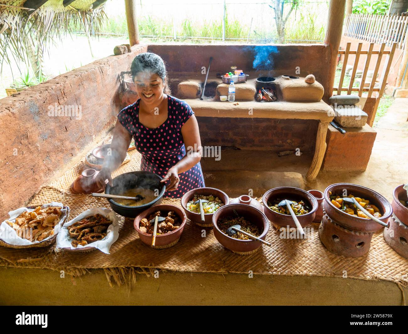Sinhala woman prepares lunch in clay pots, Sri Lanka Stock Photo - Alamy