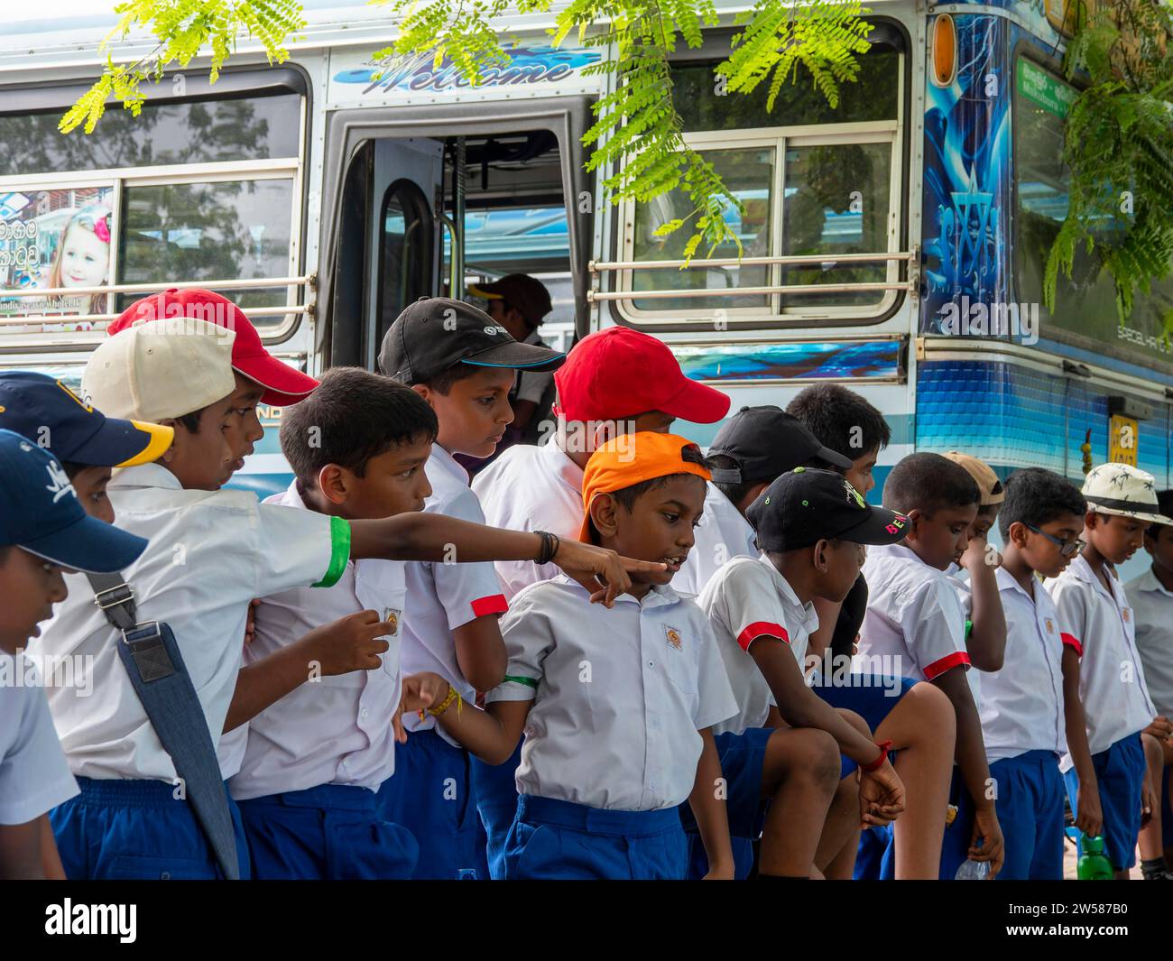 Schoolchildren with school bus and school uniform on an excursion, Sri ...