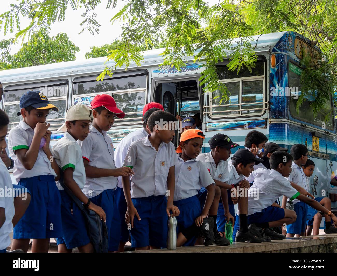 Schoolchildren with school bus and school uniform on an excursion, Sri ...