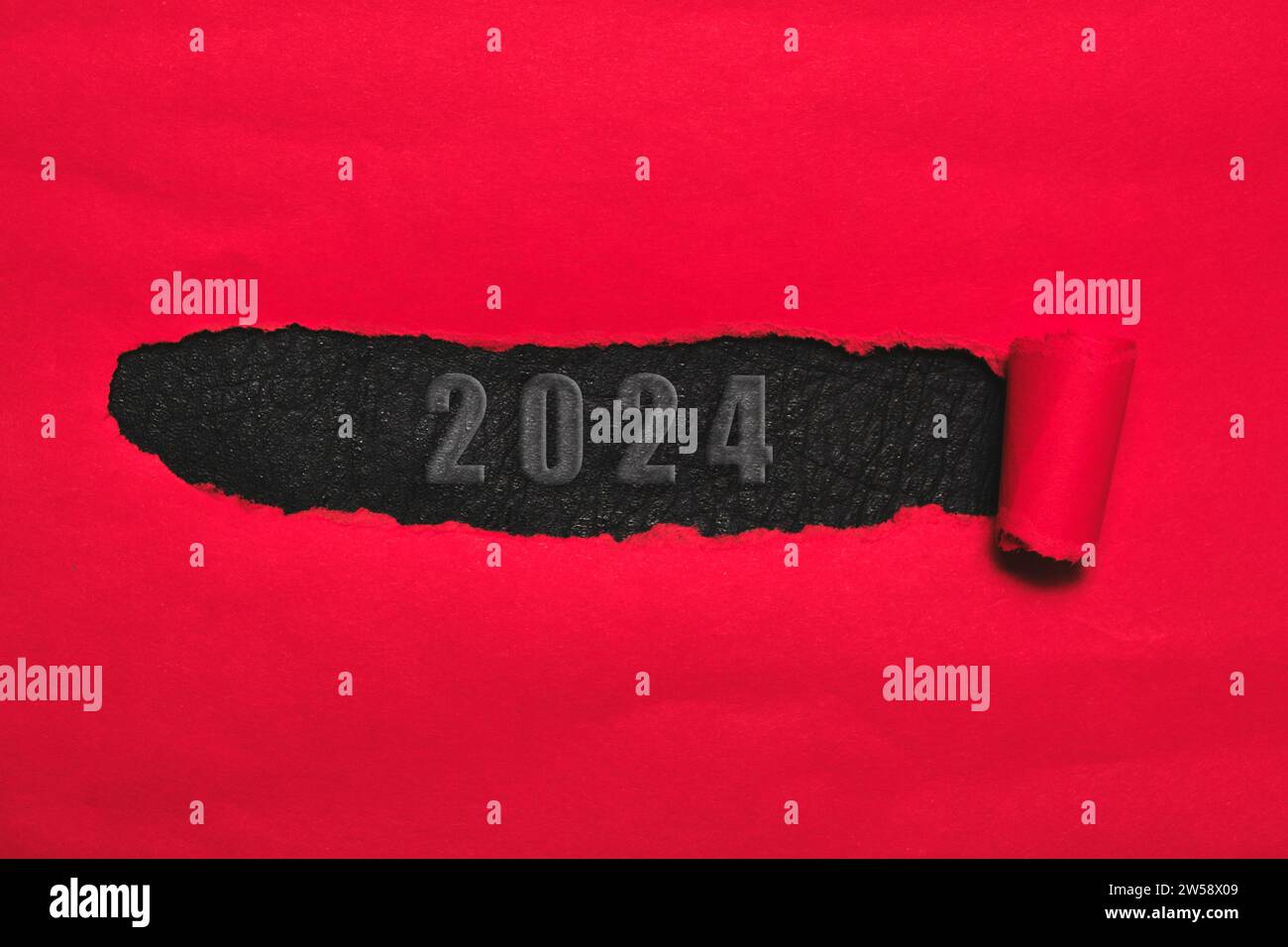 Figures for 2024 are black background with torn red paper Stock Photo ...