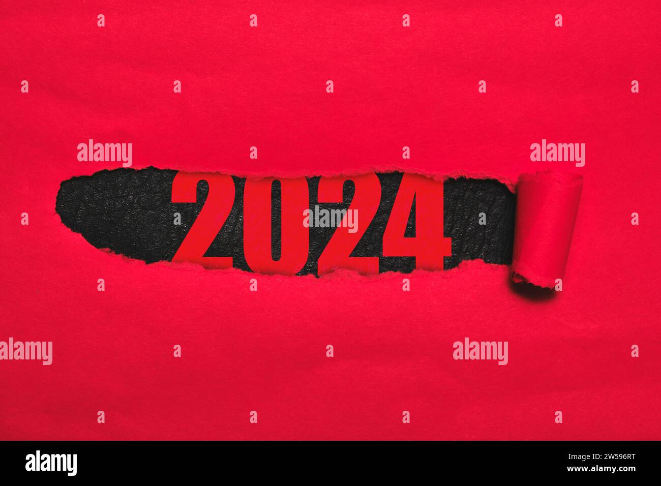 Figures for 2024 are black background with torn red paper Stock Photo ...