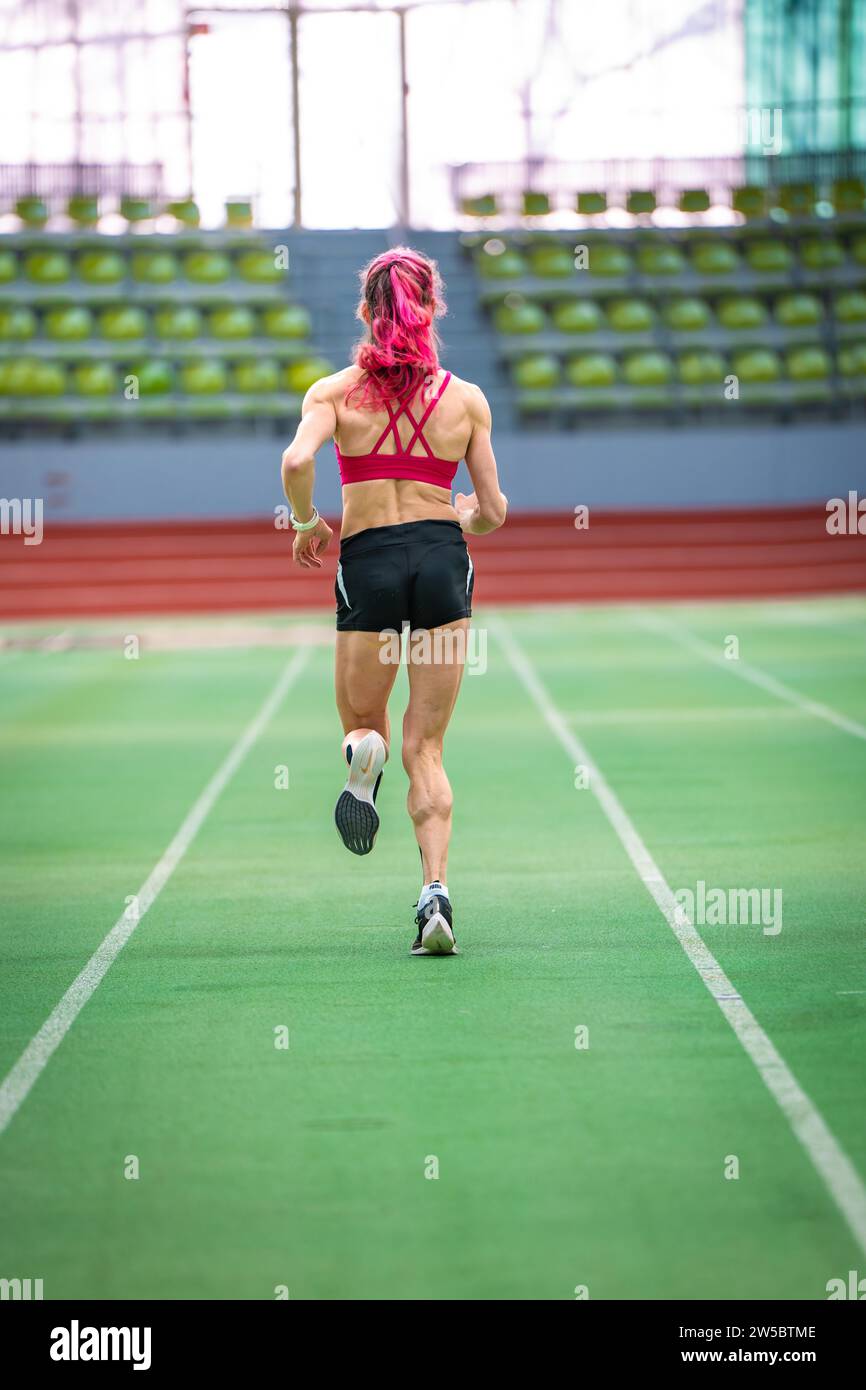 Fast athlete training in the stadium, emphasising movement and speed ...
