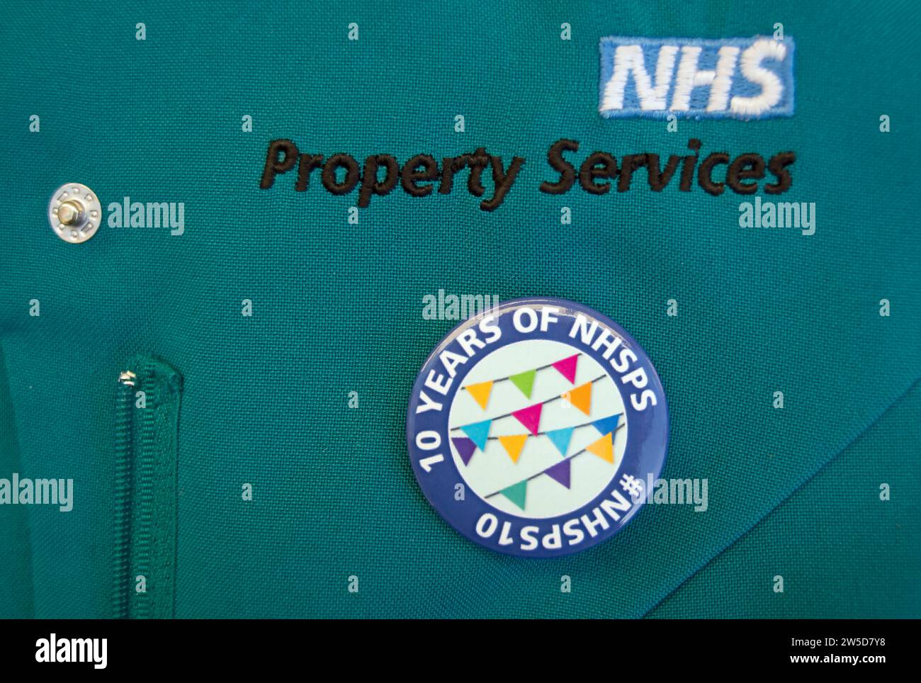 lapel badge marking ten years of national health service property services (nhsps) worn on an ...