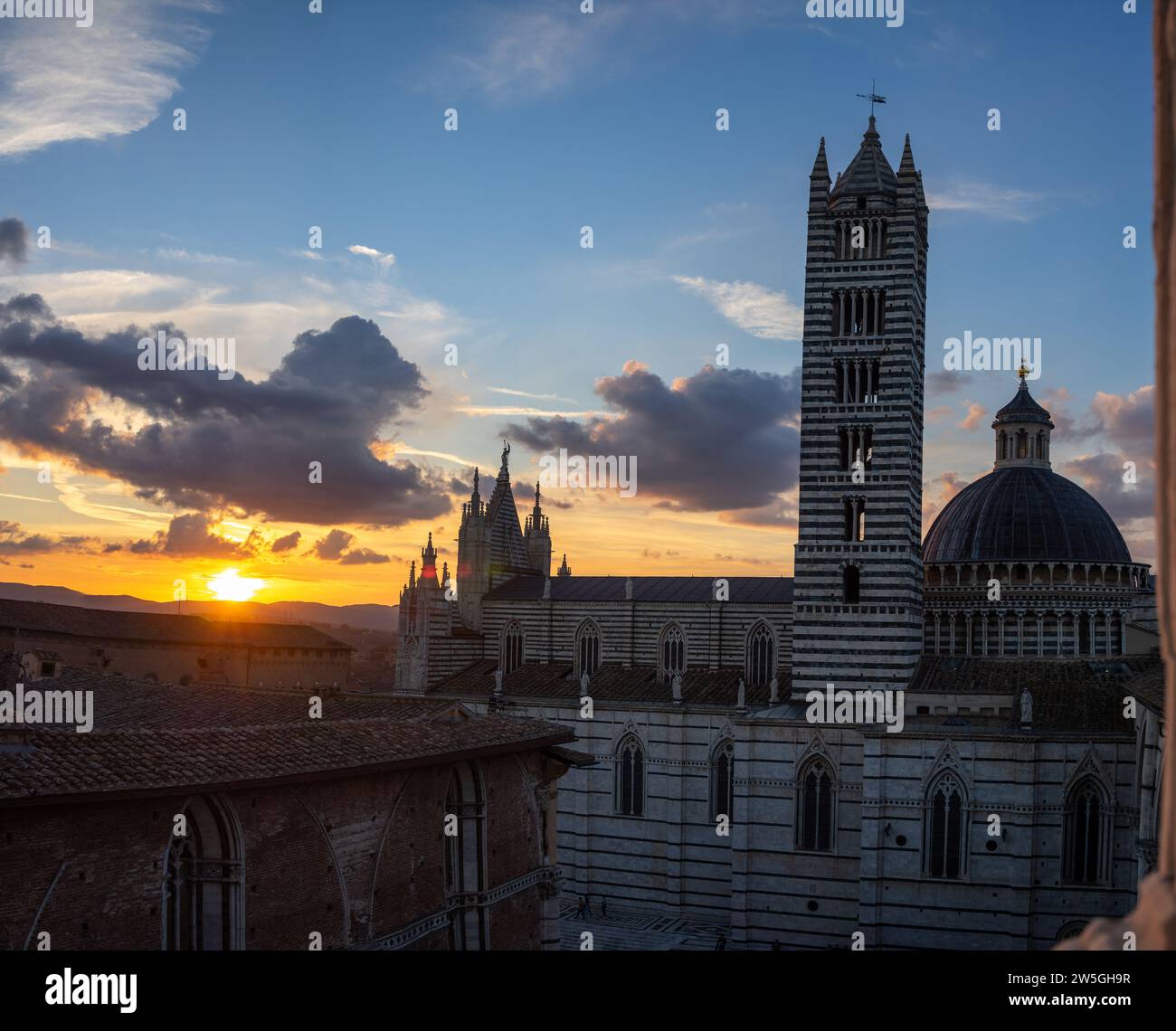 Siena Duomo silhouette at sunset Stock Photo - Alamy