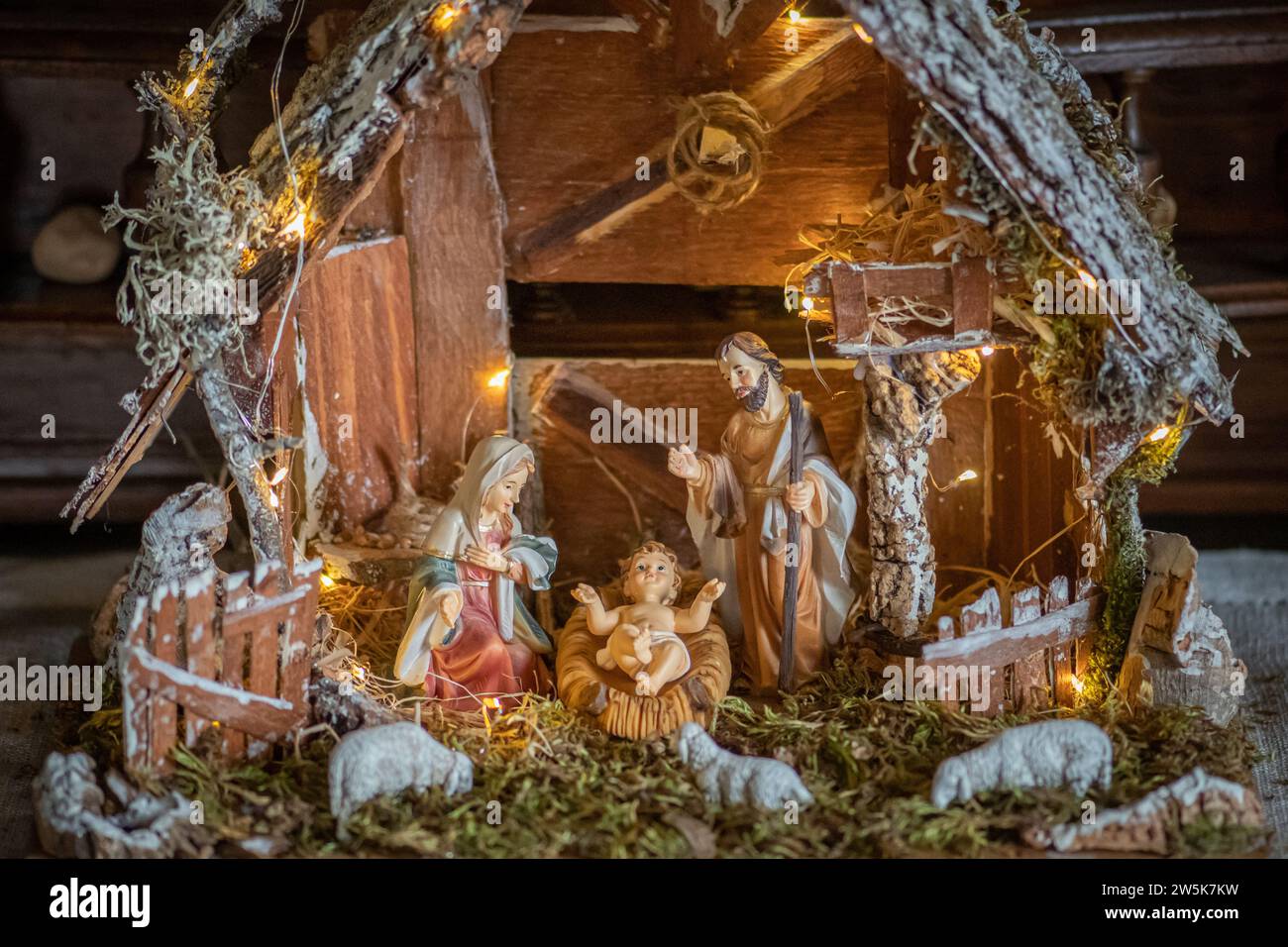 Beautiful Christmas nativity scene with holy family in a handmade wooden old stable, Italian ...