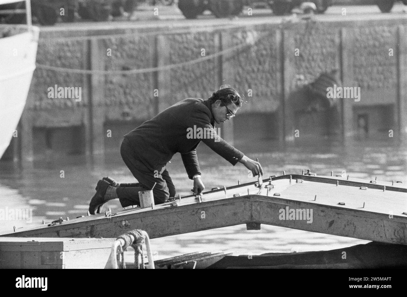A man working at the port of Rotterdam ca. April 22, 1964 Stock Photo ...