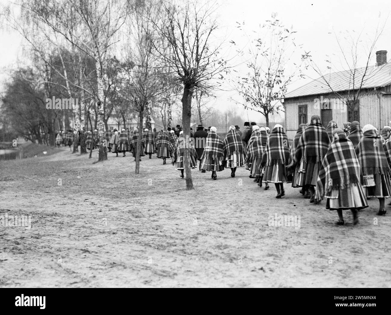 Women in traditional clothing leave the church in Lowicz on Sunday ...