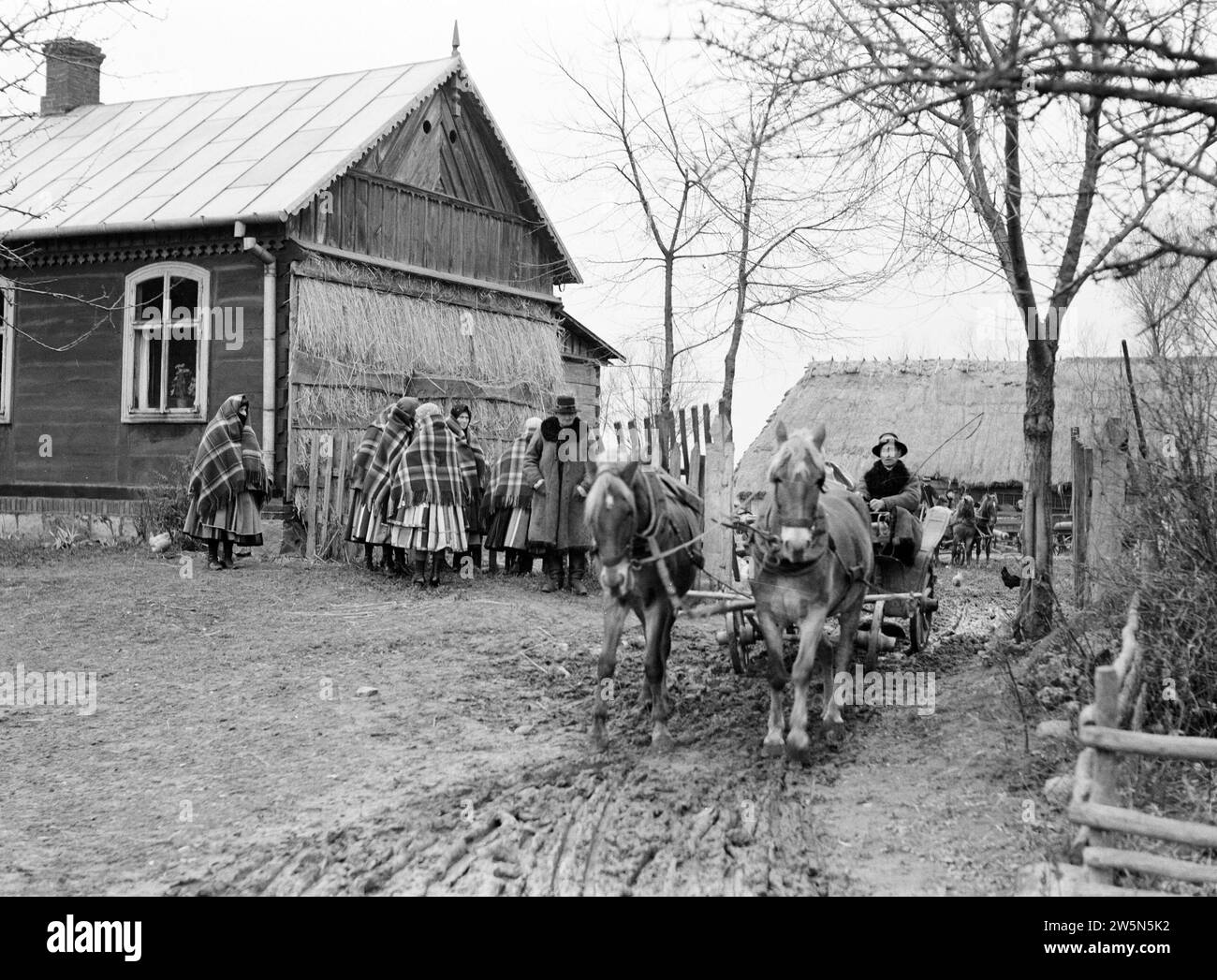 Horse and carriage pass a farm in Lowicz ca. 1934 Stock Photo - Alamy