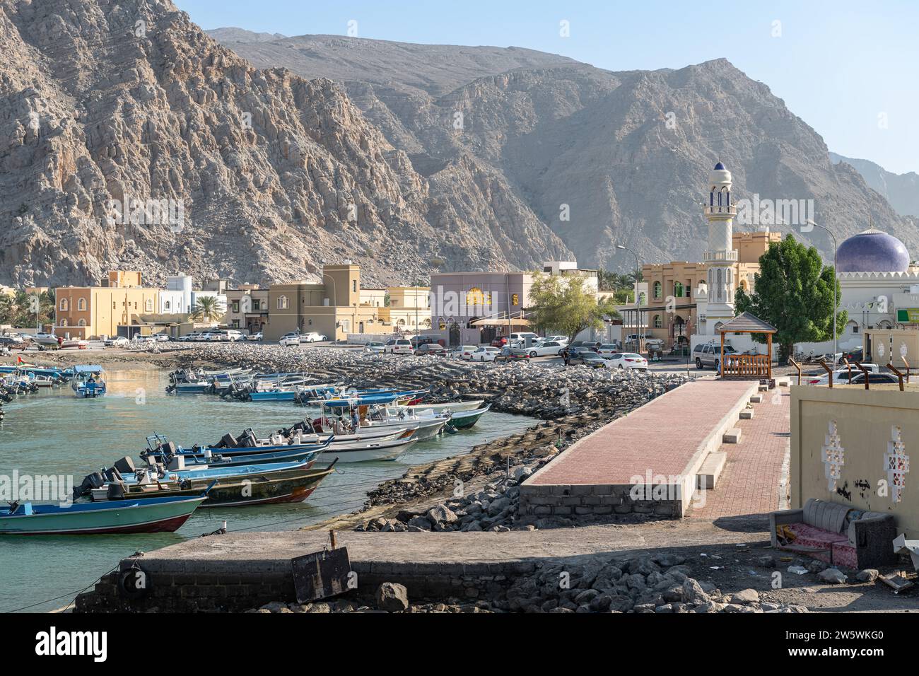 Boats moored at the end of the eastern Sea Canal with Khasab town ...