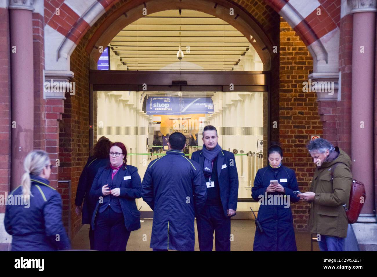London, England, UK. 21st Dec, 2023. Eurostar staff stand outside the ...