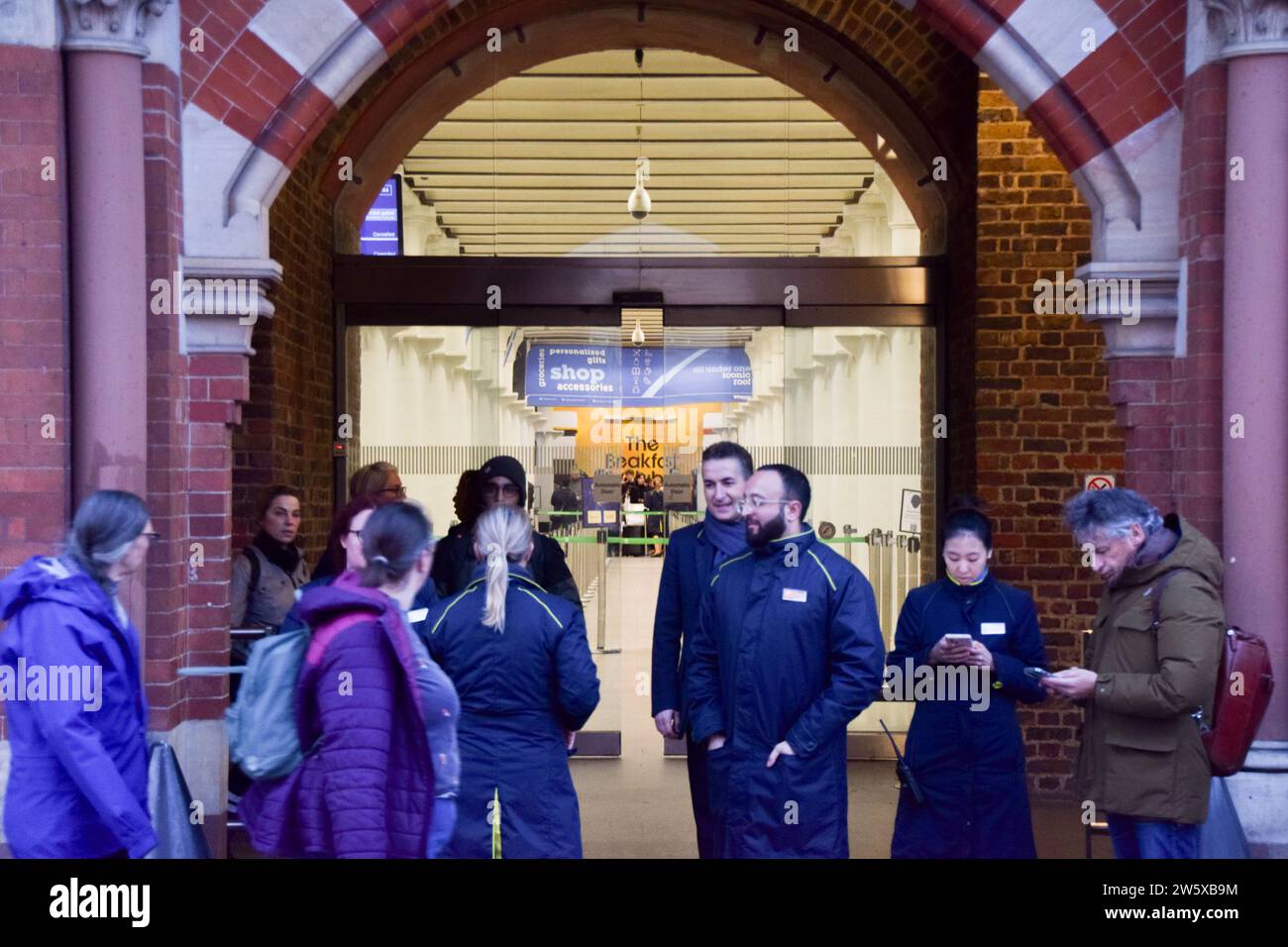 London, England, UK. 21st Dec, 2023. Eurostar staff stand outside the ...