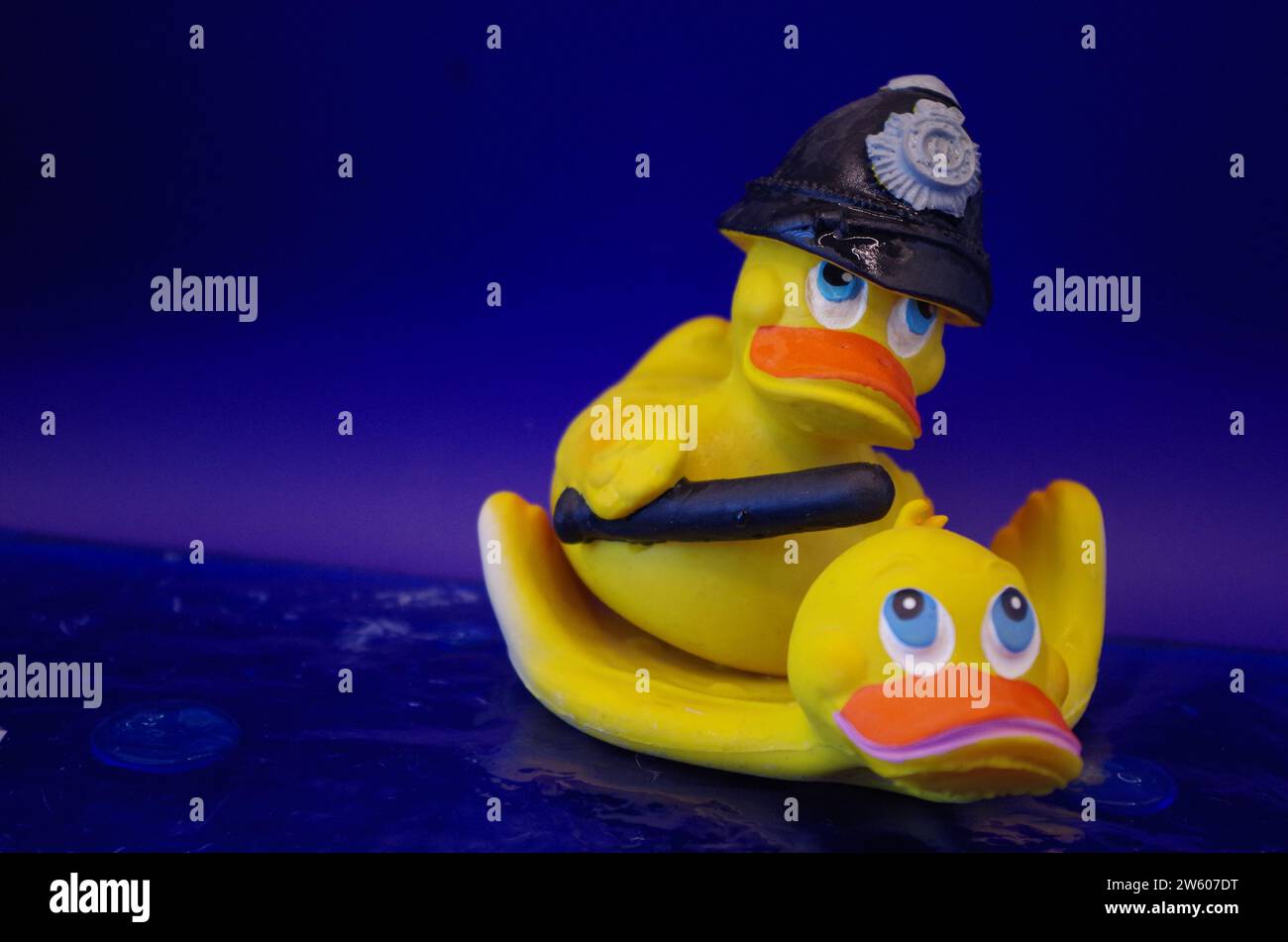Two rubber ducks, conceptual in table shot Stock Photo - Alamy