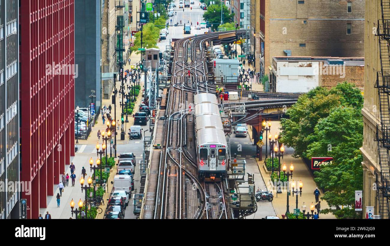 Train on railroad in big, inner city aerial of Chicago tourism transit and travel Stock Photo ...