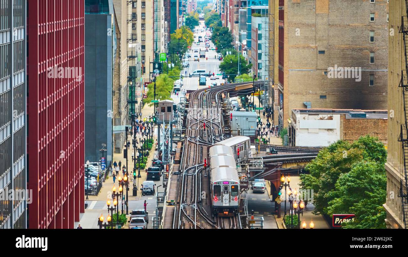 Train on railroad in big, inner city aerial of Chicago tourism transit ...