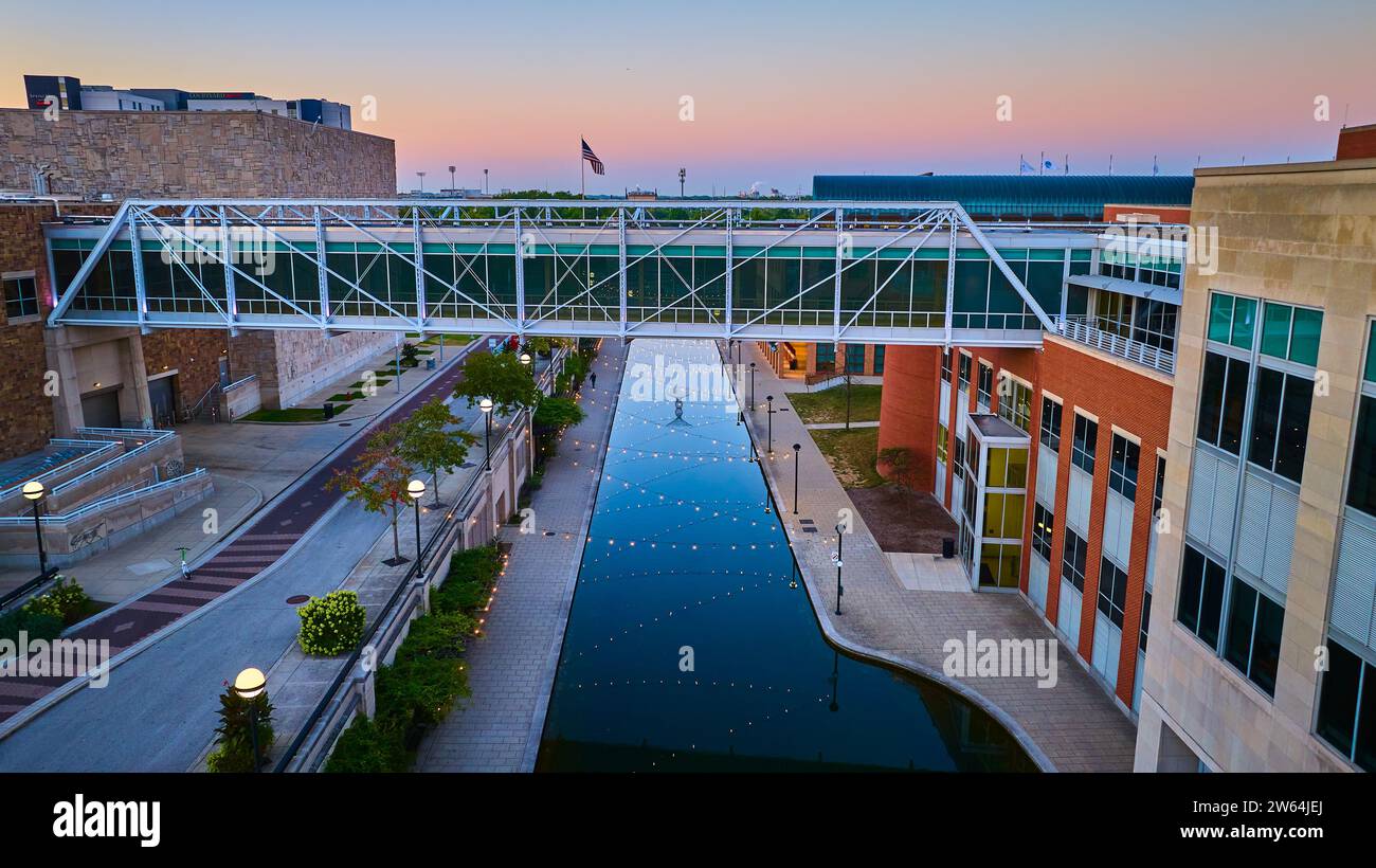 Aerial Twilight Urban Campus with Pedestrian Bridge and Reflective ...
