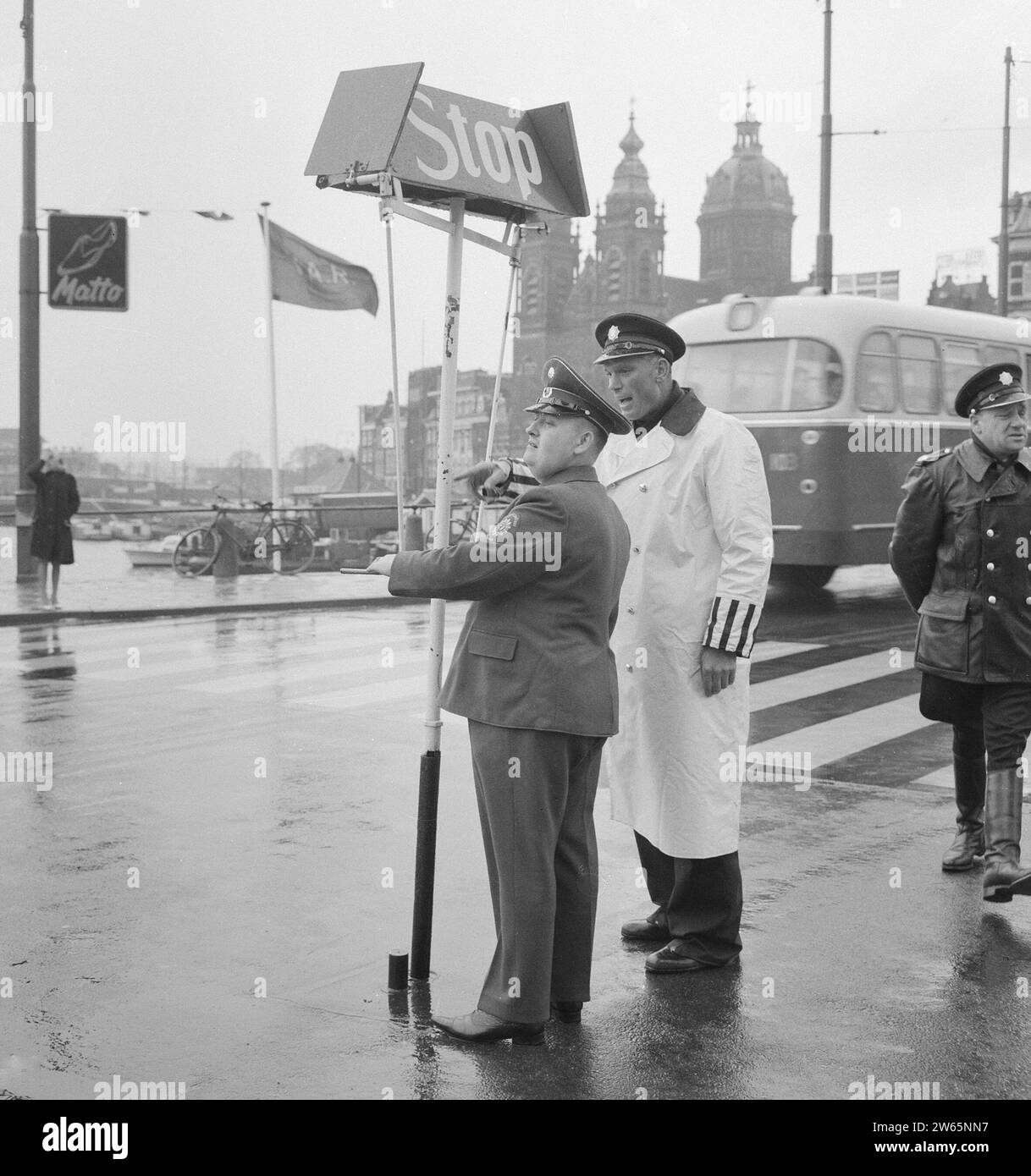 (original caption) West German agent arranges traffic Damrak, Prins ...