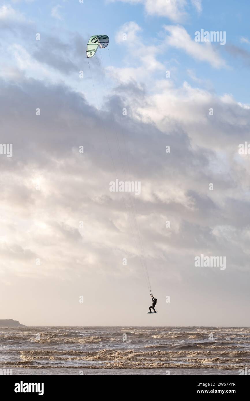 Weston super Mare, UK. A Kitesurfer or Kiteboarder takes advantage of ...