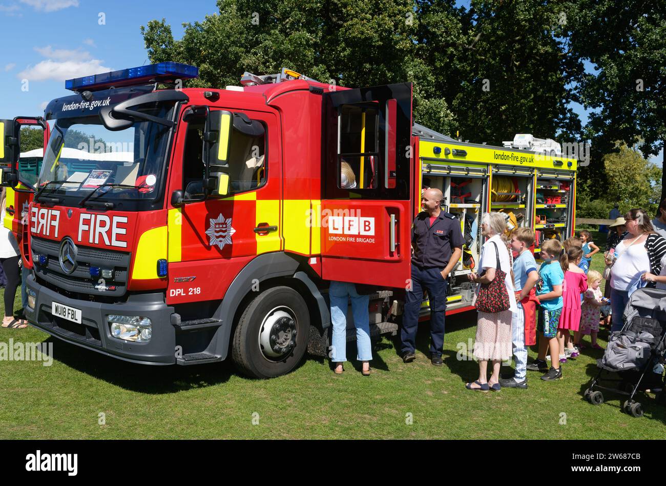 Fireman showing the public and children a fire engine at the Met On The ...