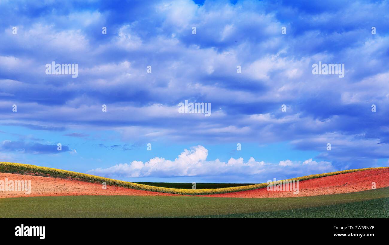 Layered landscape with undulating fields under a dramatic sky ...