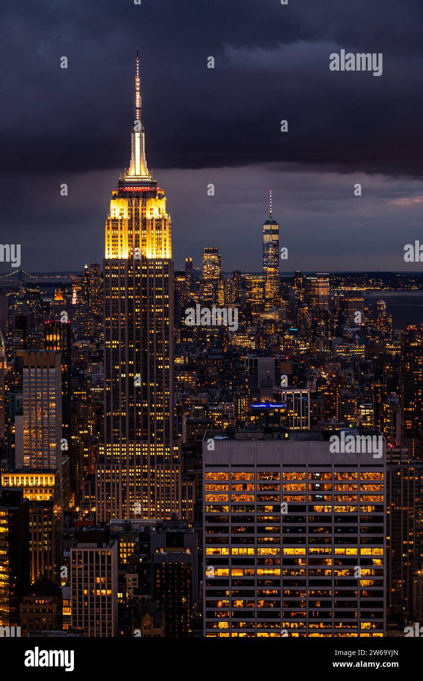 Aerial view of cityscape with illuminated skyscrapers and Empire State ...